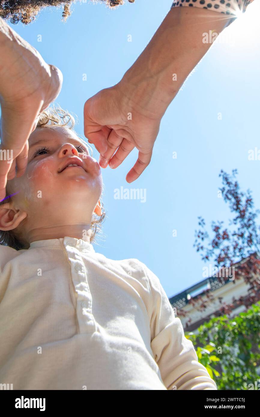 Holding joyful hi-res stock photography and images - Alamy