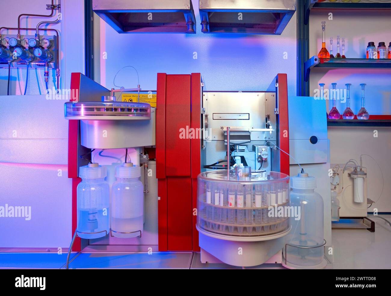 High-tech laboratory equipment illuminating the room with a blue glow ...