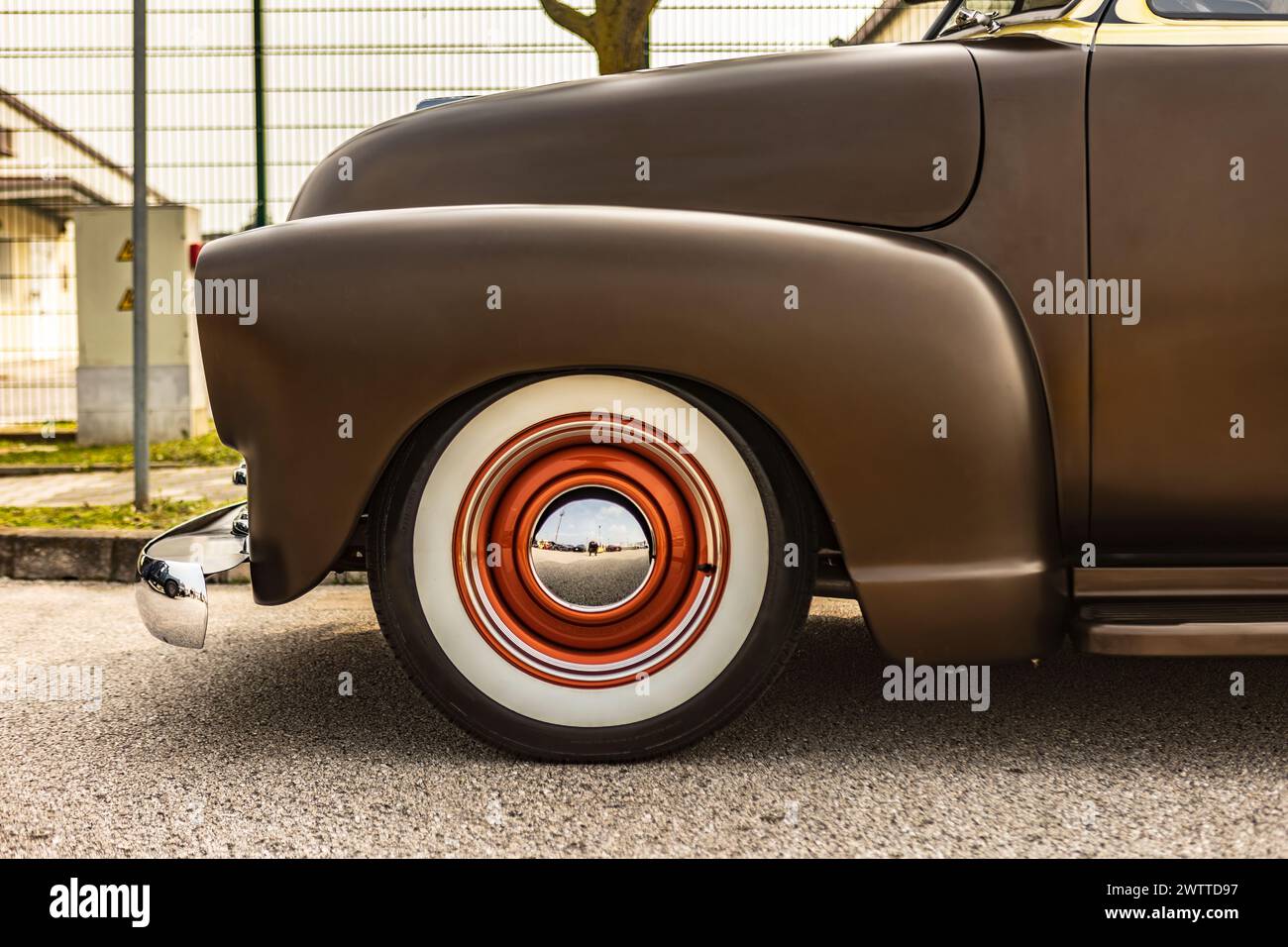 Close-up of a vintage Chevy pickup's chrome wheel, showcasing classic ...