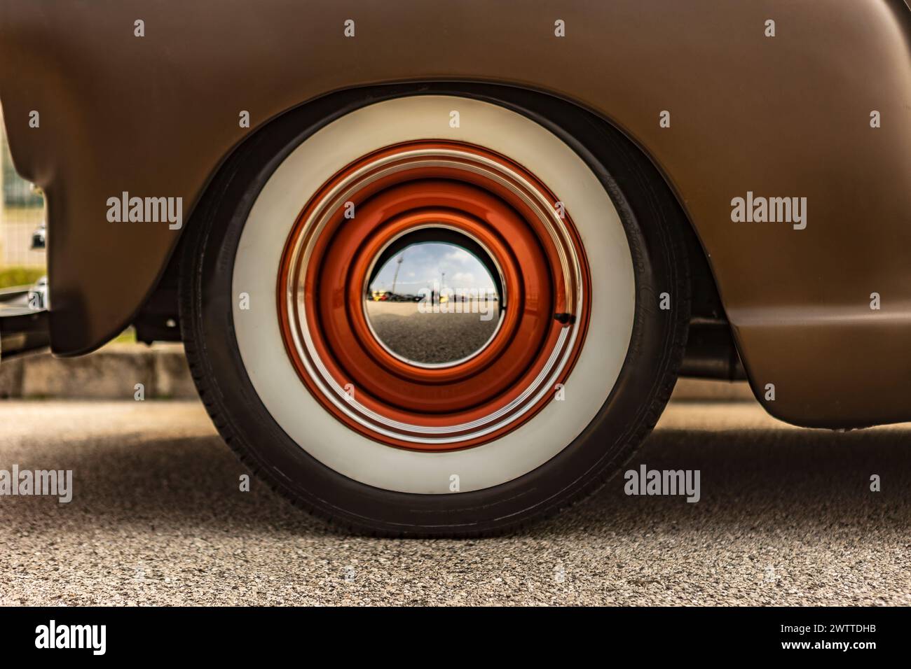 Close-up of a vintage Chevy pickup's chrome wheel, showcasing classic ...