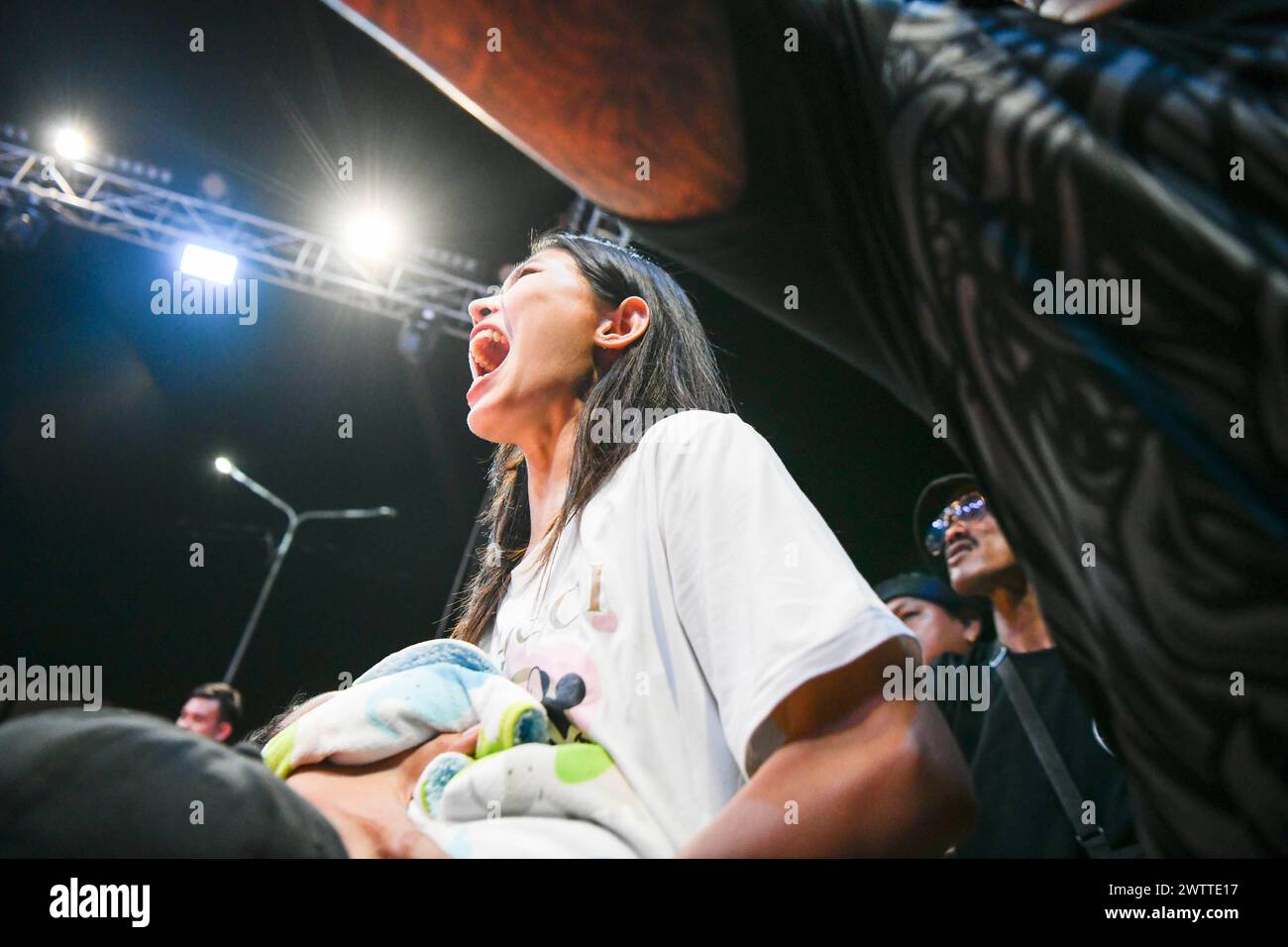 Boxing fans cheer for their boxers at Fight Club Thailand in Navanakorn ...