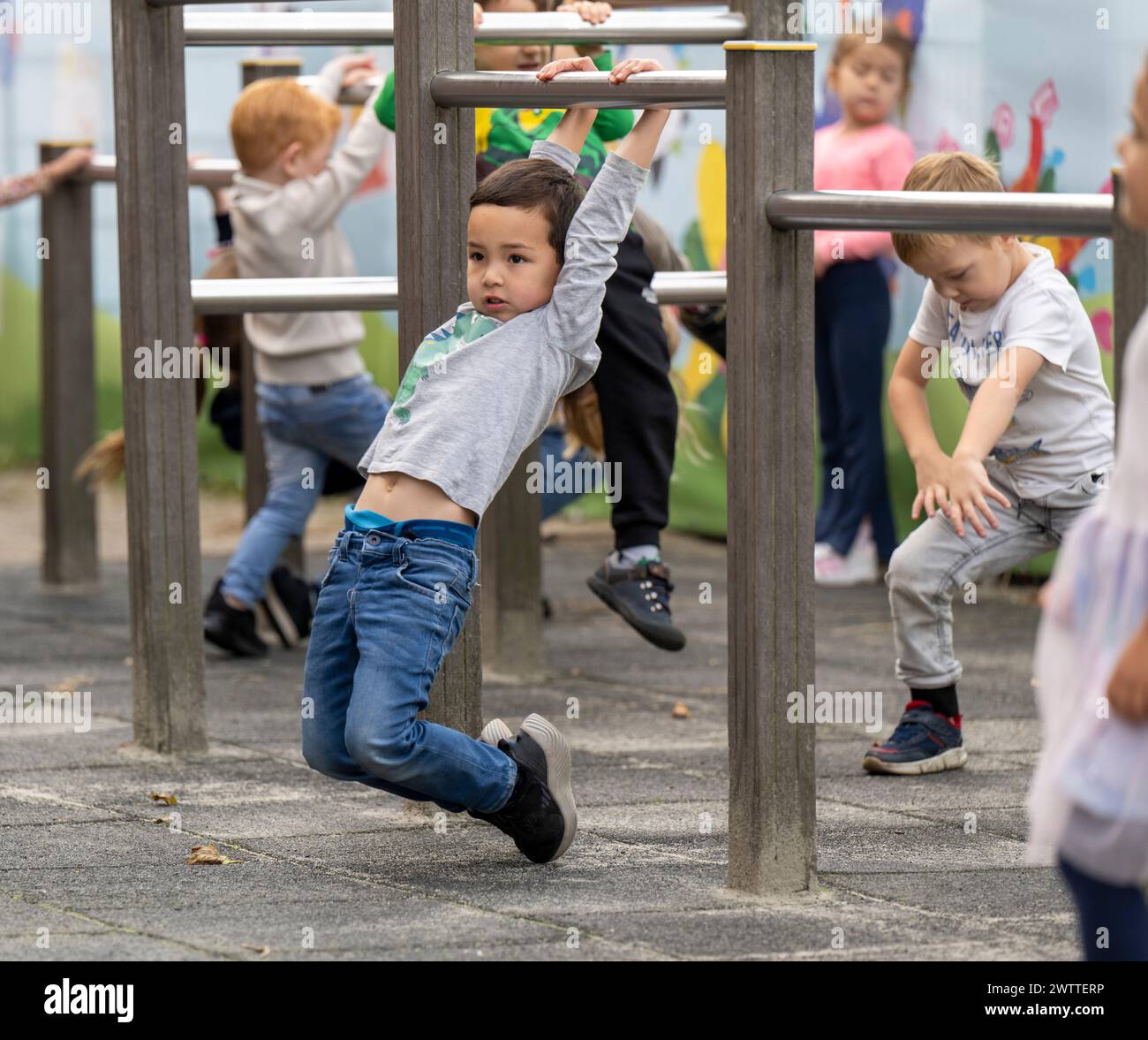 Kids enjoying playtime at a playground Stock Photo - Alamy
