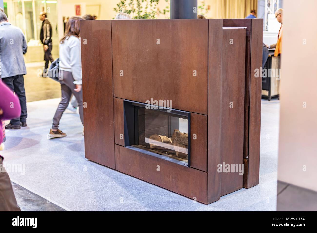 Elegant fireplace on display at a furniture fair, blending modern ...