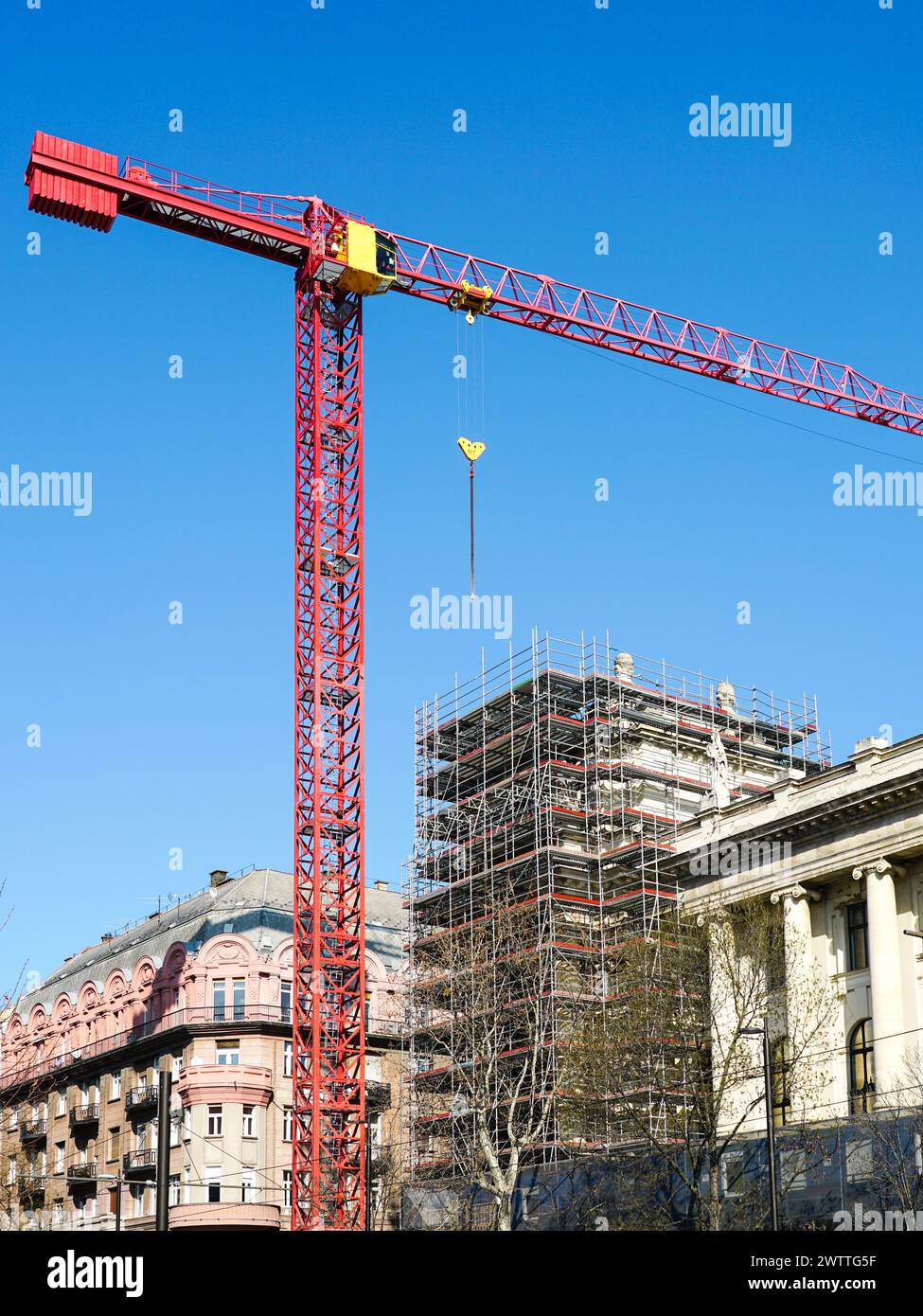 Historical house facade restoration and roof repair using scaffolding ...