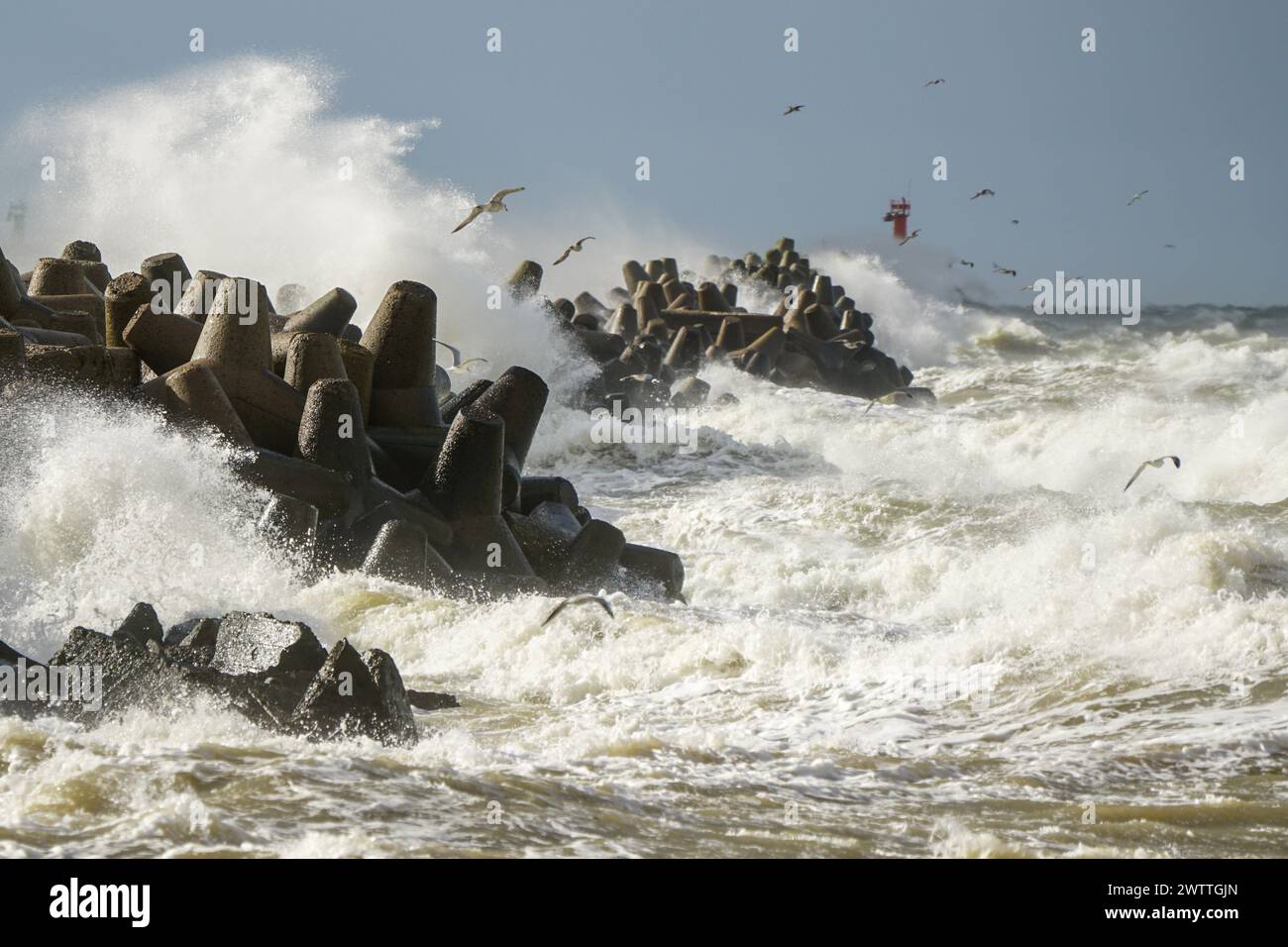 Storm at sea, high waves crashing against the concrete breakwaters of ...