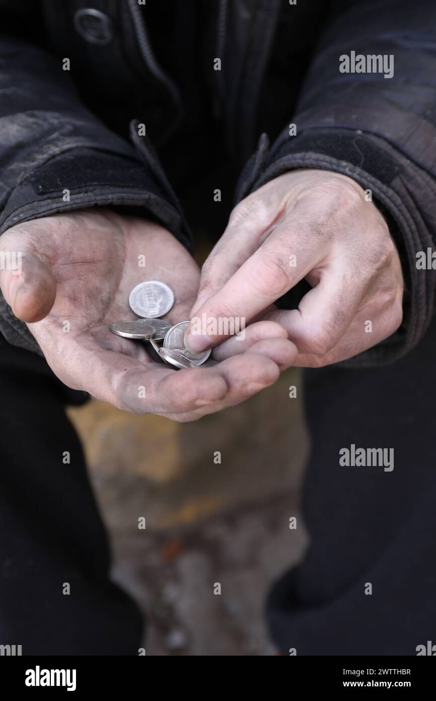 Homeless man counting money hi-res stock photography and images - Alamy