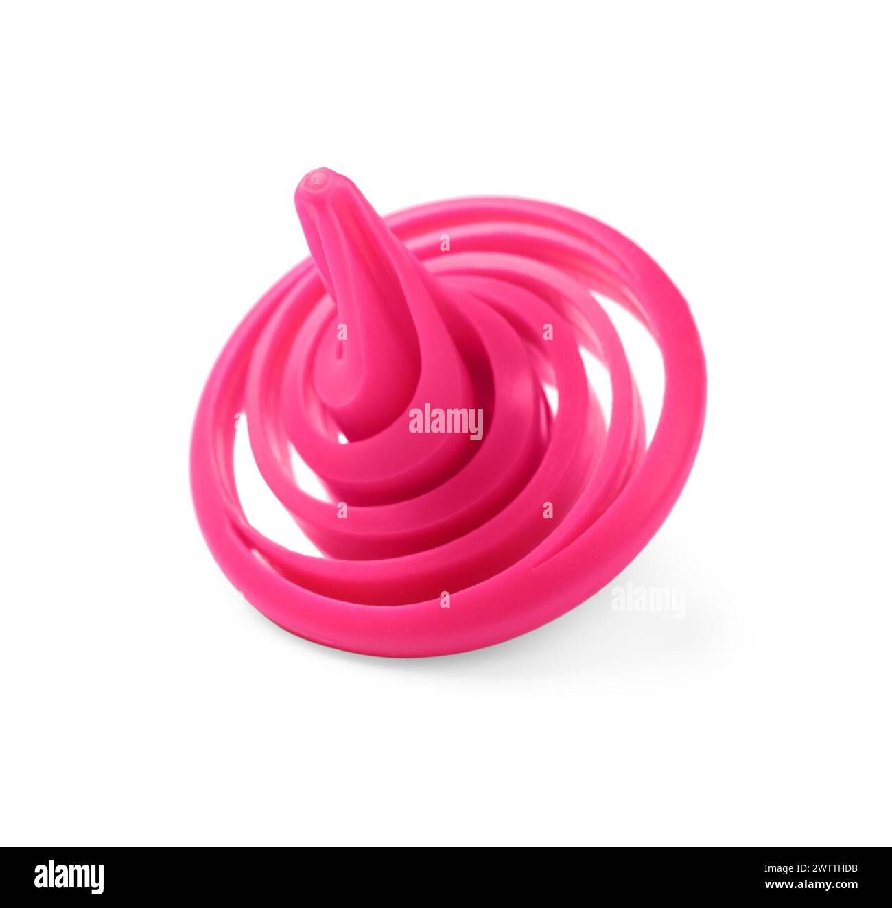 One pink spinning top isolated on white Stock Photo - Alamy