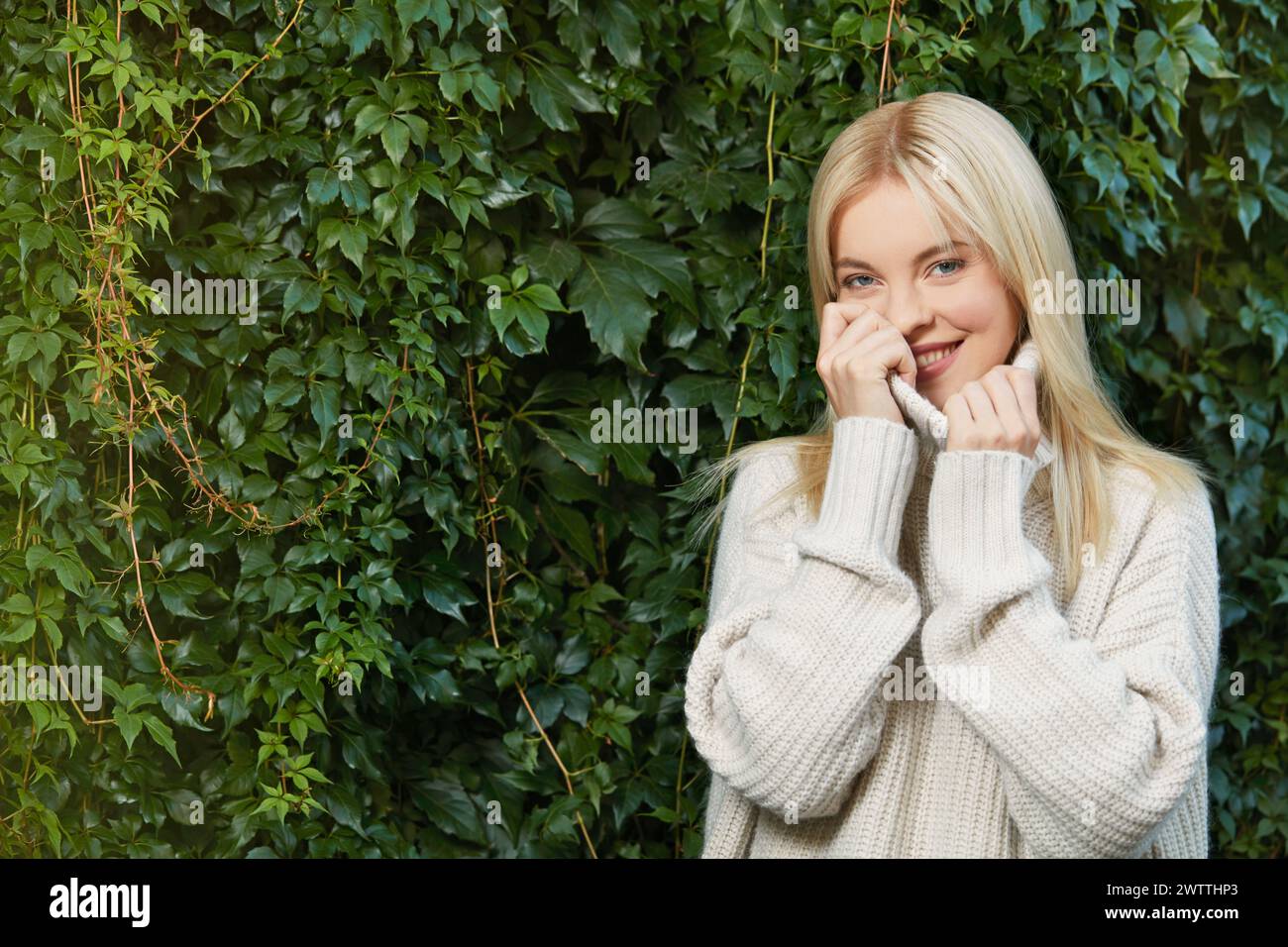 Woman in white sweater on hi-res stock photography and images - Alamy