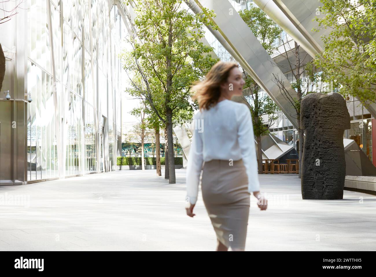 Woman walking through urban area hi-res stock photography and images ...