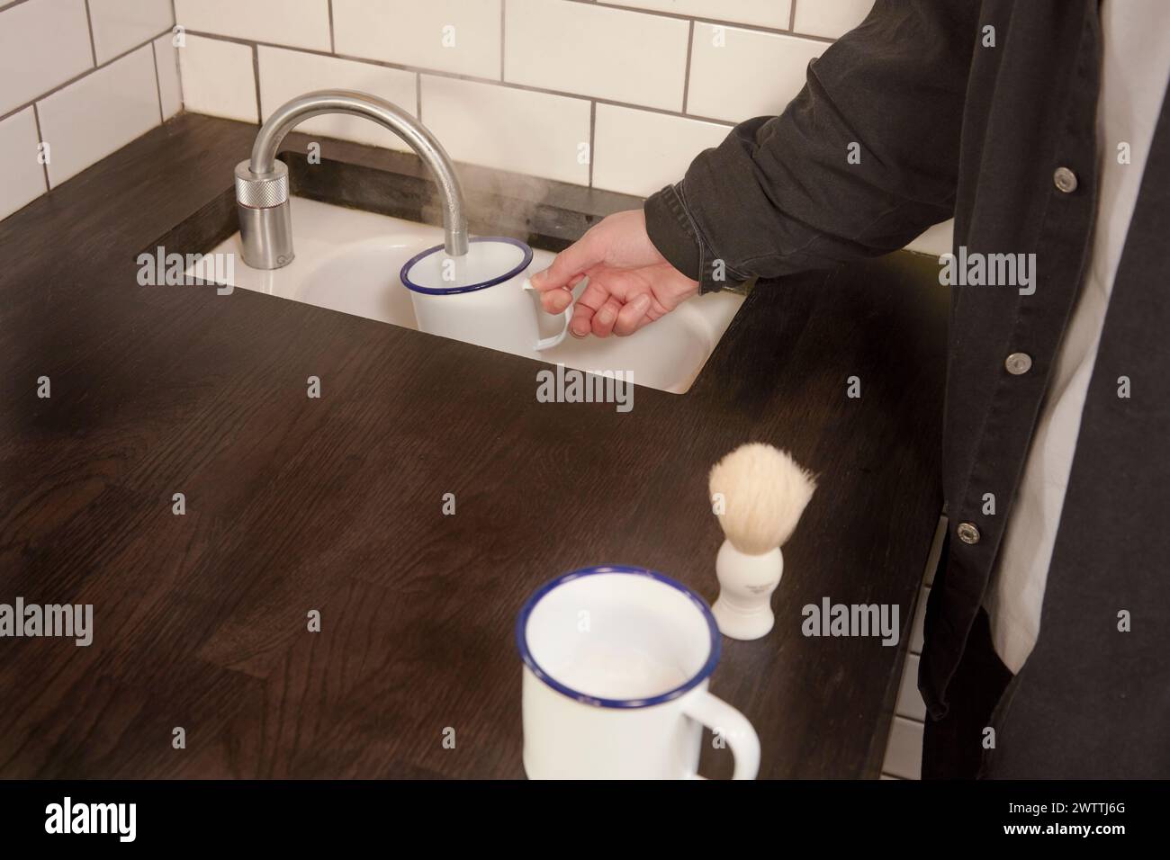 Pouring kettle into sink hi-res stock photography and images - Alamy