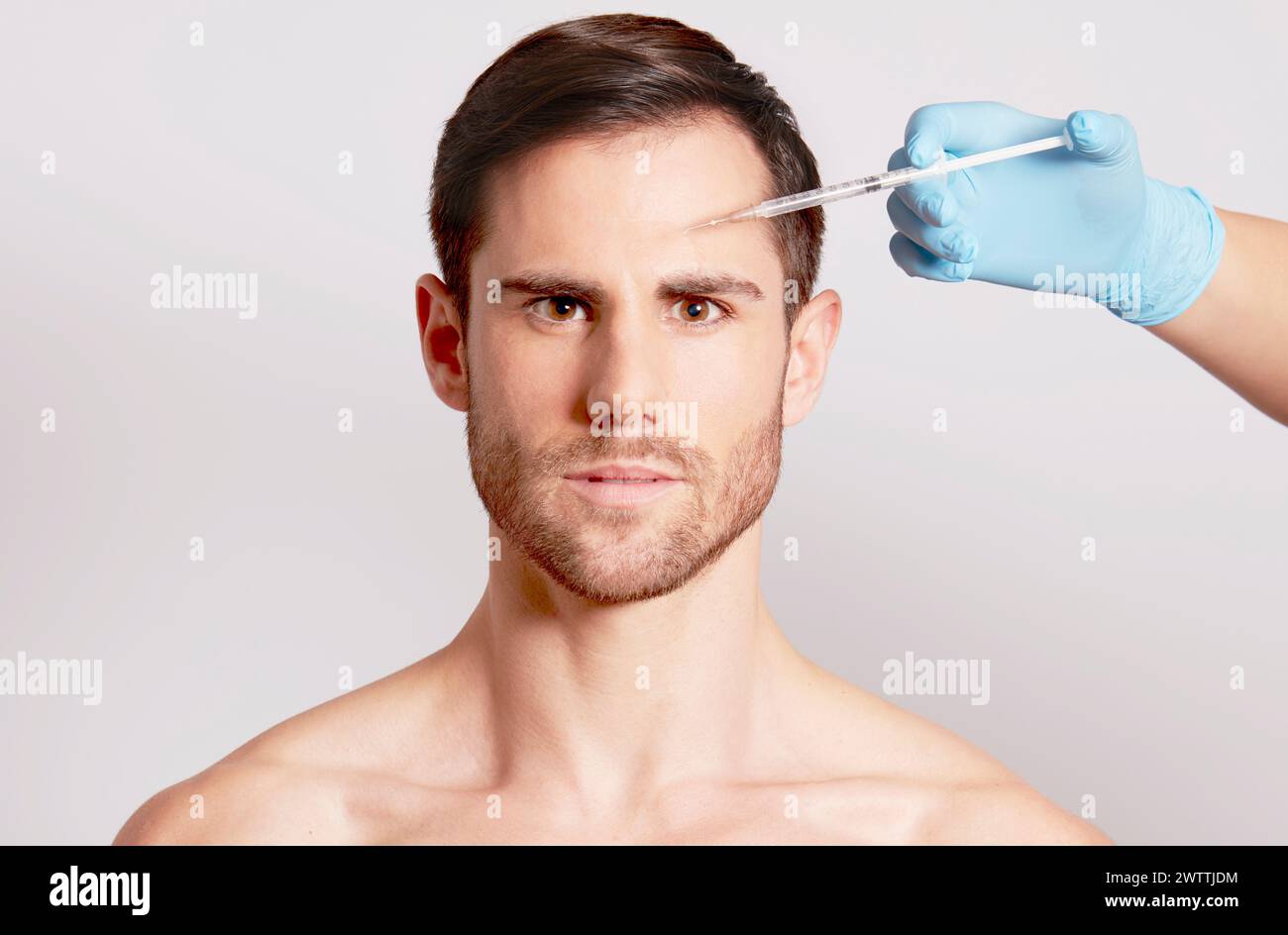 Man receiving facial injection treatment Stock Photo - Alamy