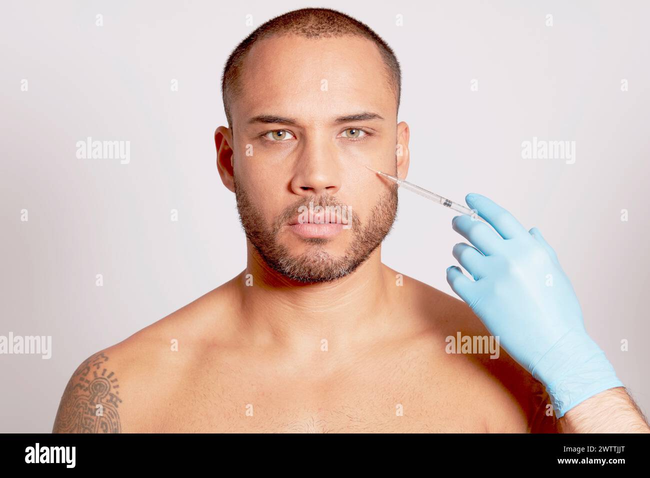 Man receiving facial injection Stock Photo - Alamy
