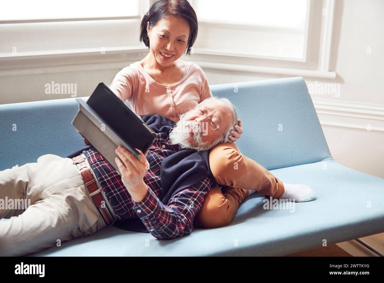 Man with head on womans lap hi-res stock photography and images - Alamy
