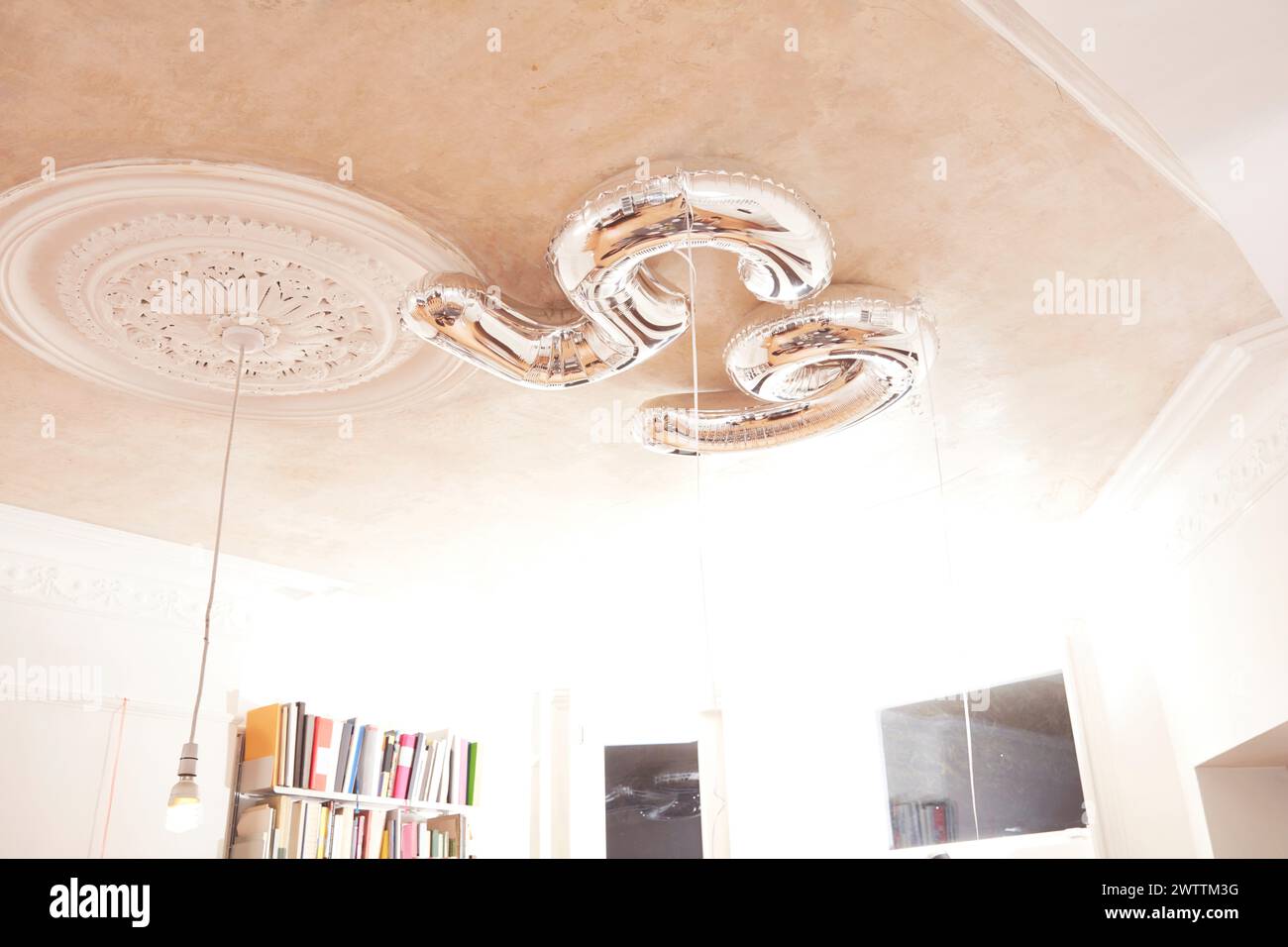 Silver balloon numeral on a decorated ceiling Stock Photo - Alamy
