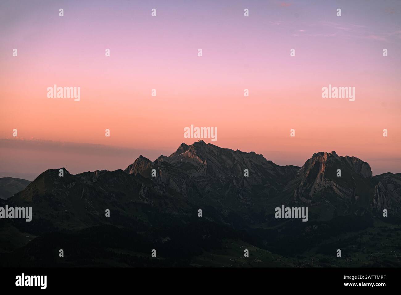 Two close mountains under the setting sun, viewed from a peak Stock ...
