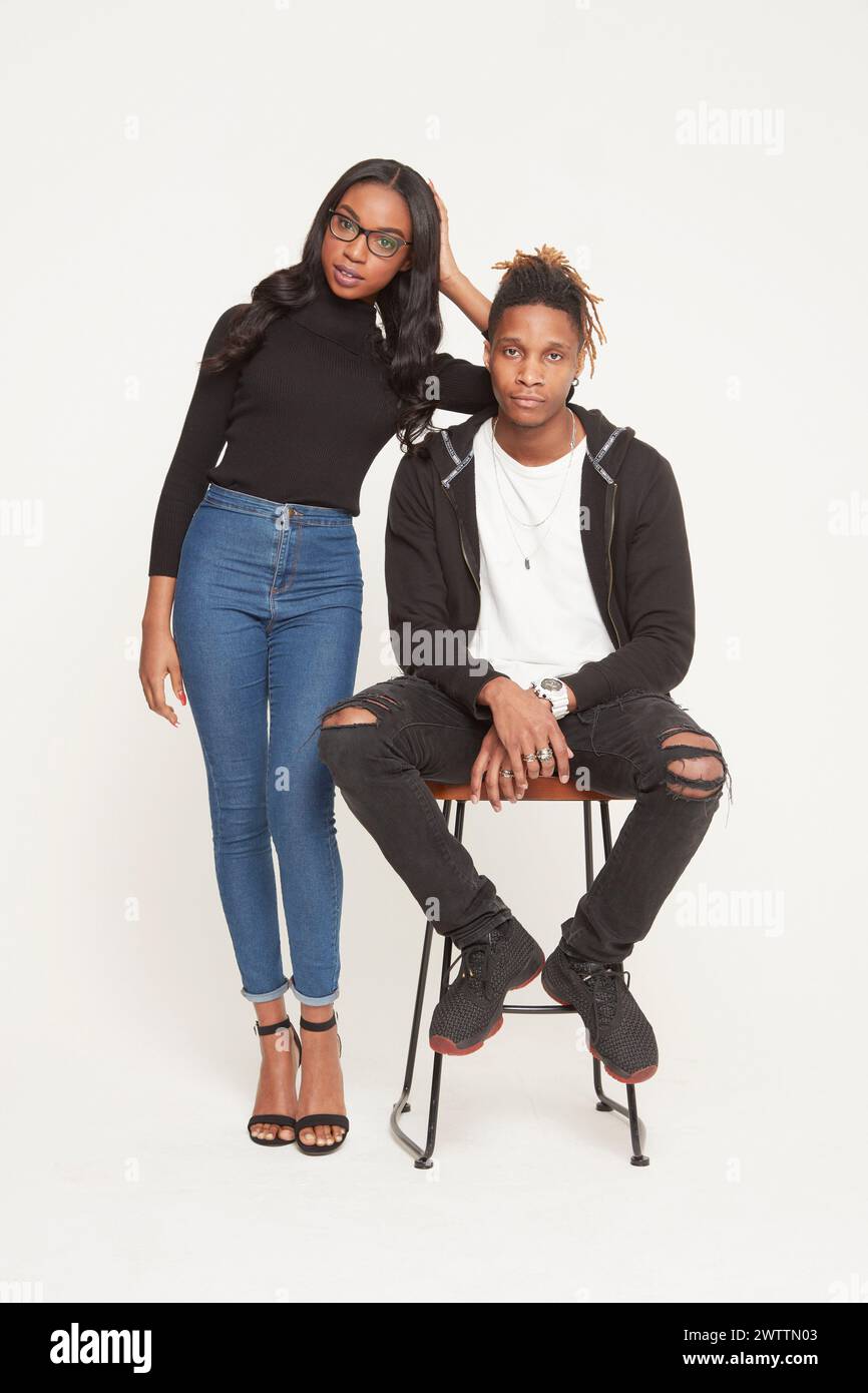 Black man sitting on a stool hi-res stock photography and images - Alamy