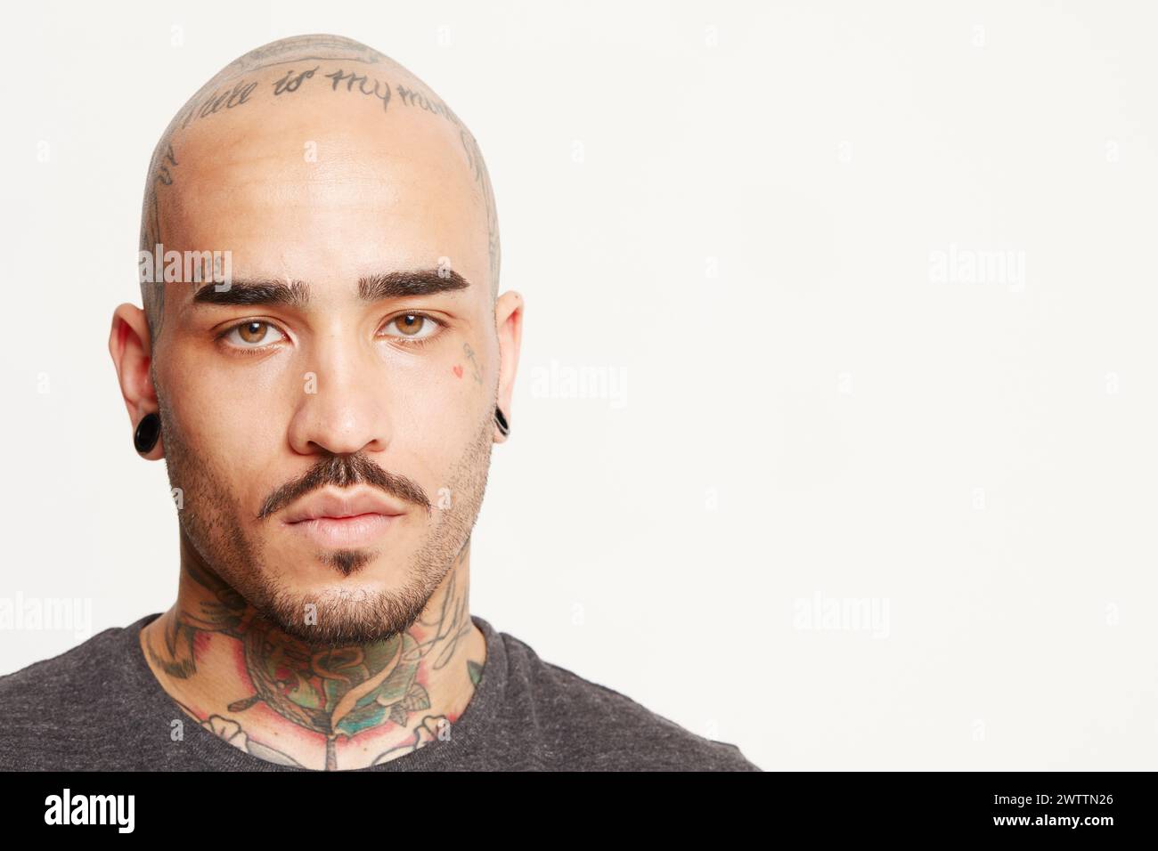 Portrait of a tattooed man on a white background Stock Photo - Alamy
