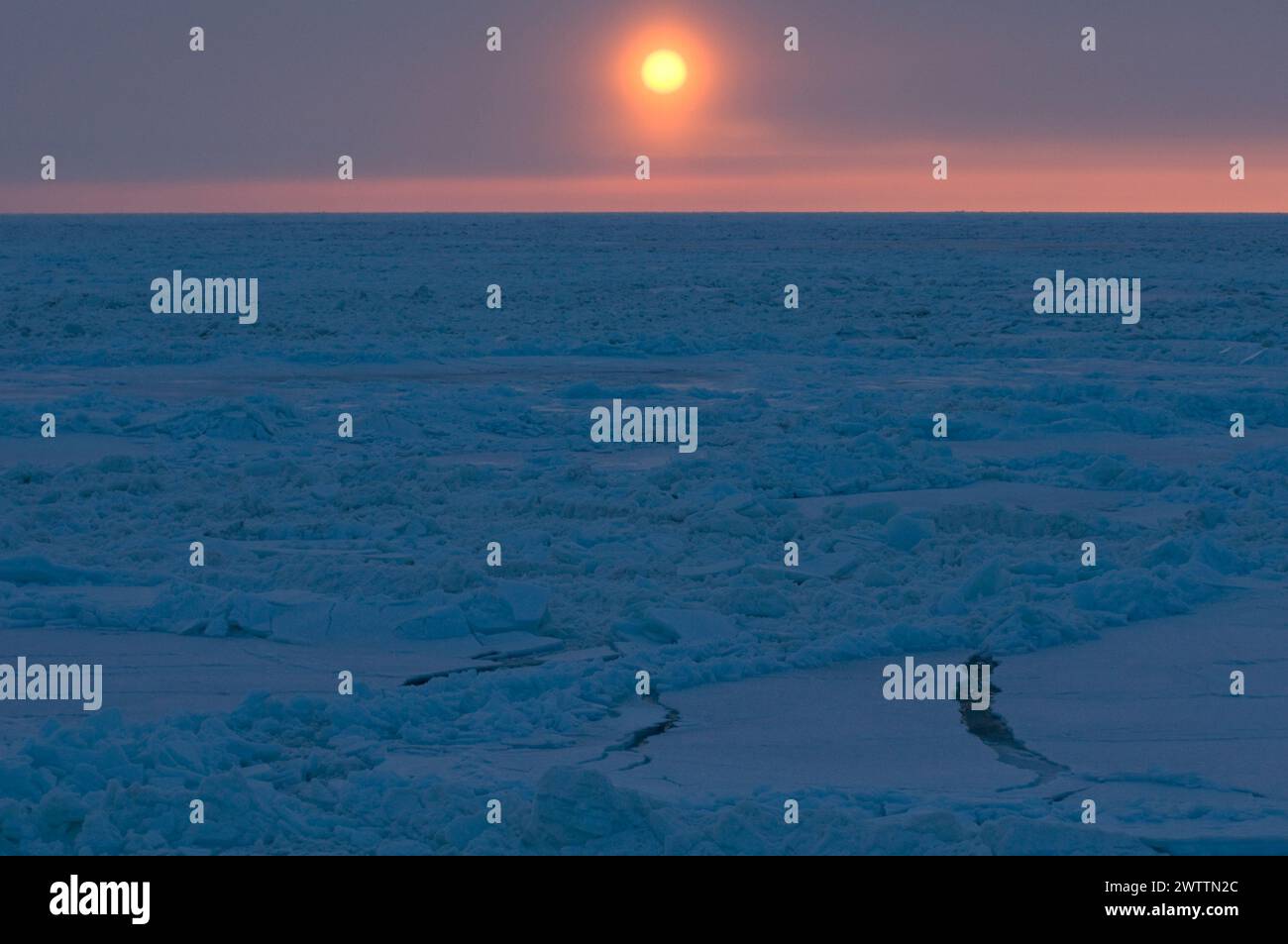 Seascape of sunset over open lead rough pack ice over the Chukchi sea ...