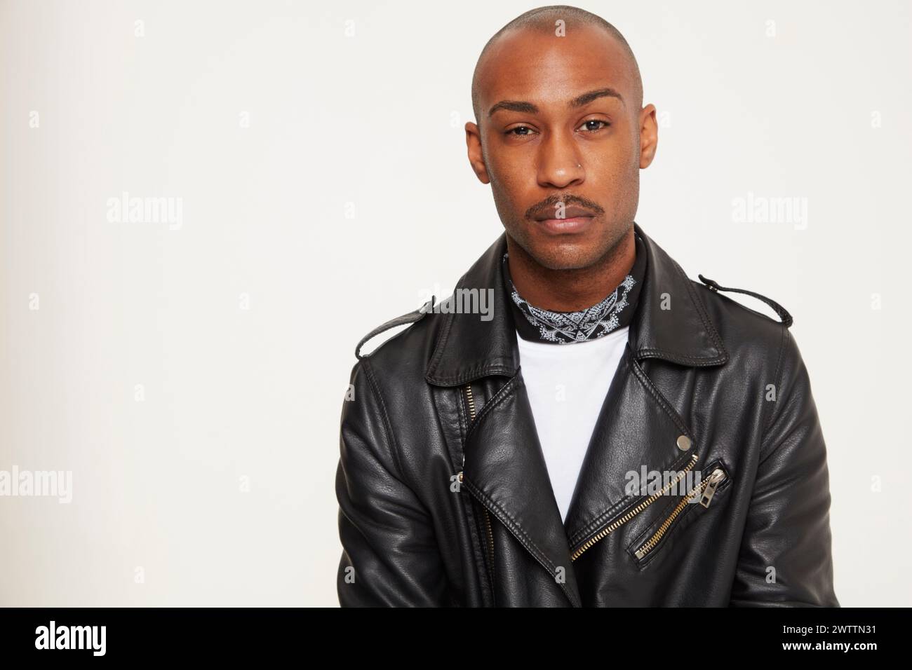 Man in leather jacket posing for portrait Stock Photo - Alamy