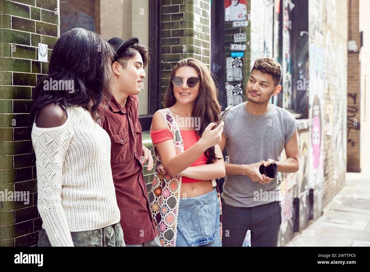 Diverse adult group friends chatting hi-res stock photography and ...