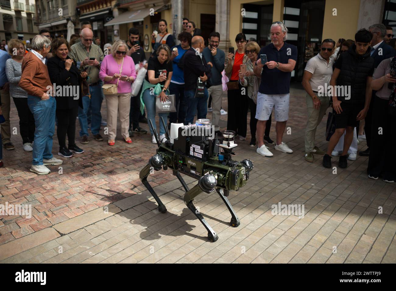 A robotic police dog prototype is seen patrolling Larios street as ...