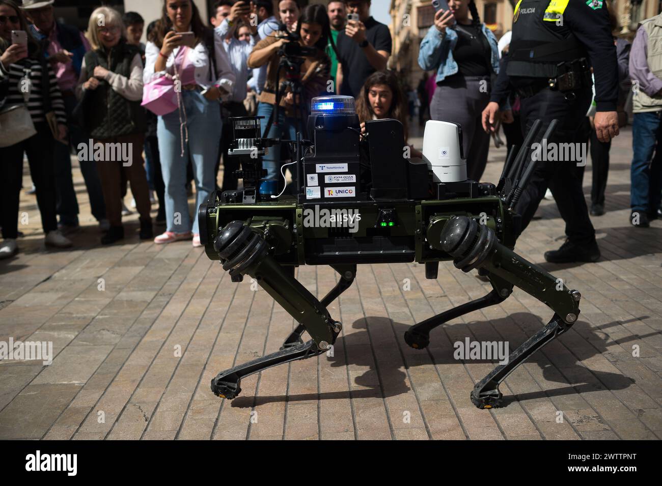 A robotic police dog prototype is seen patrolling Larios street as ...