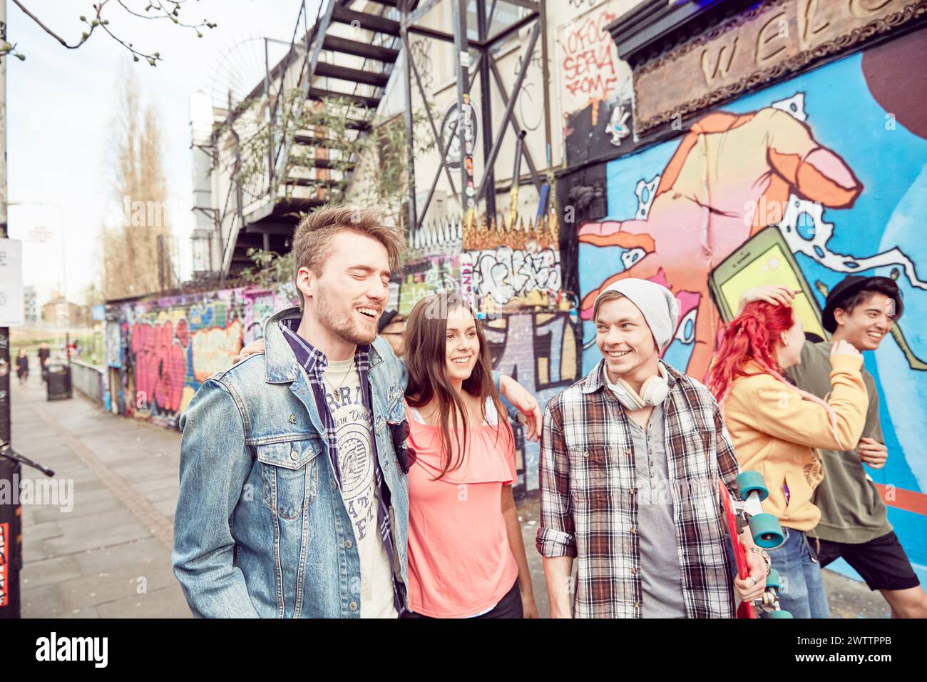 Young male female friends walking hi-res stock photography and images ...