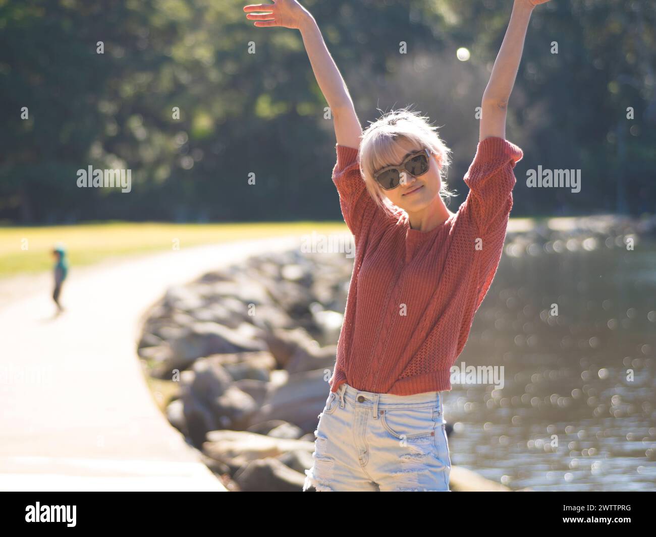 Woman raised arms sunshine hi-res stock photography and images - Alamy