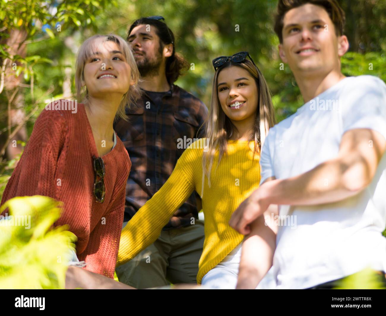 Friends enjoying time together outdoors Stock Photo - Alamy