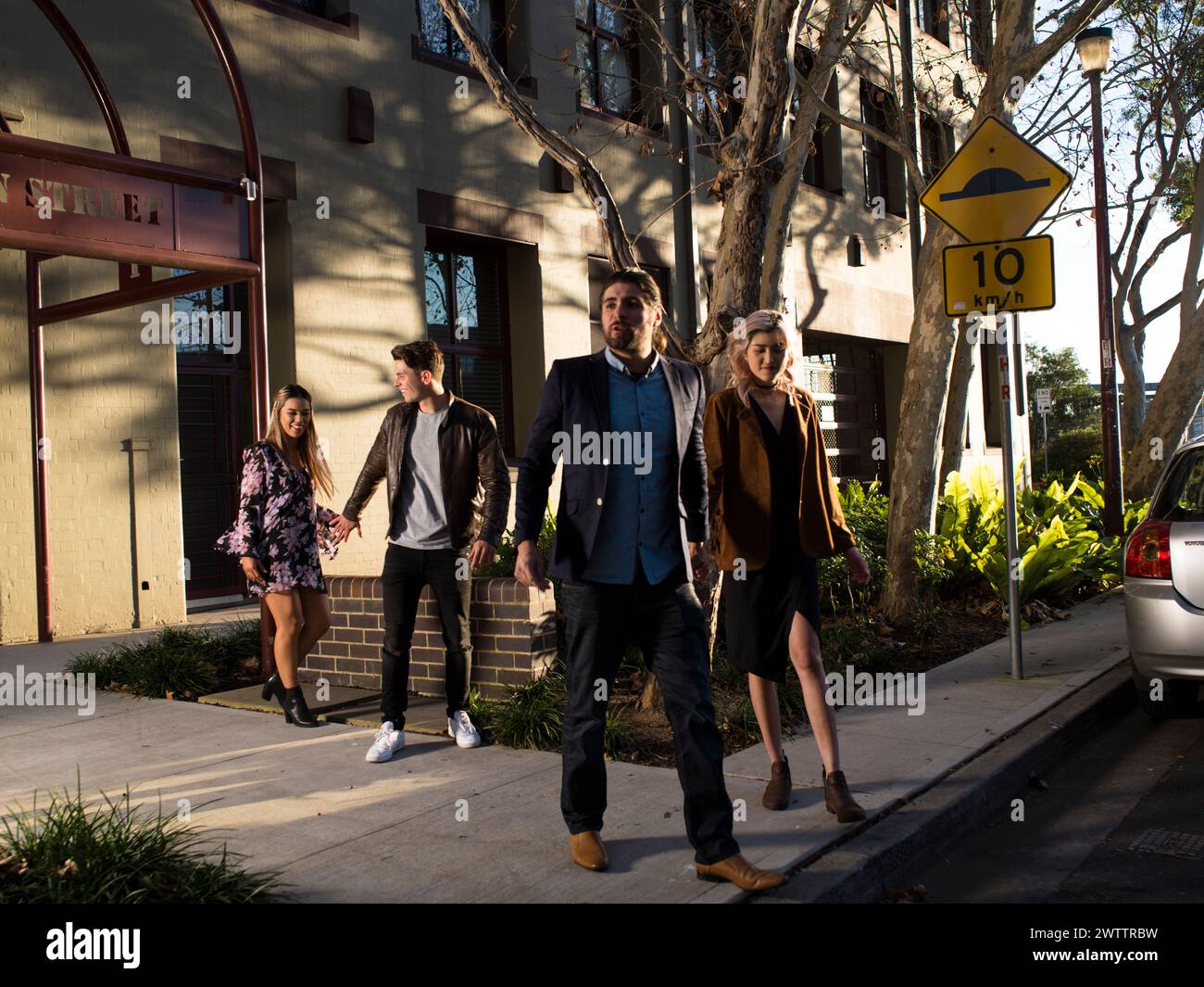 Pedestrians walking by roadside hi-res stock photography and images - Alamy