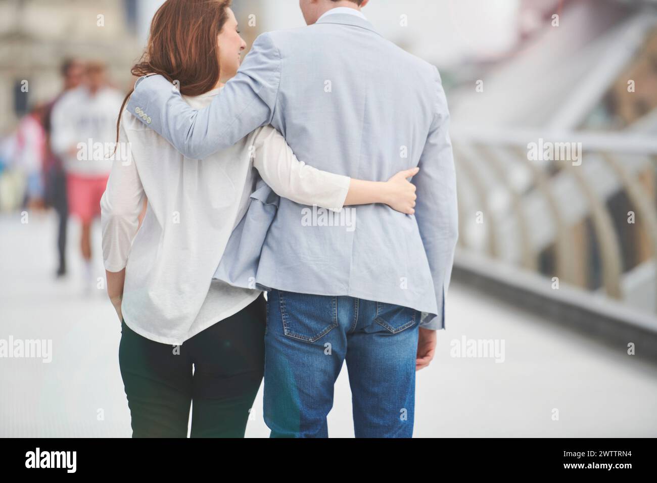Walking arm in arm hi-res stock photography and images - Alamy