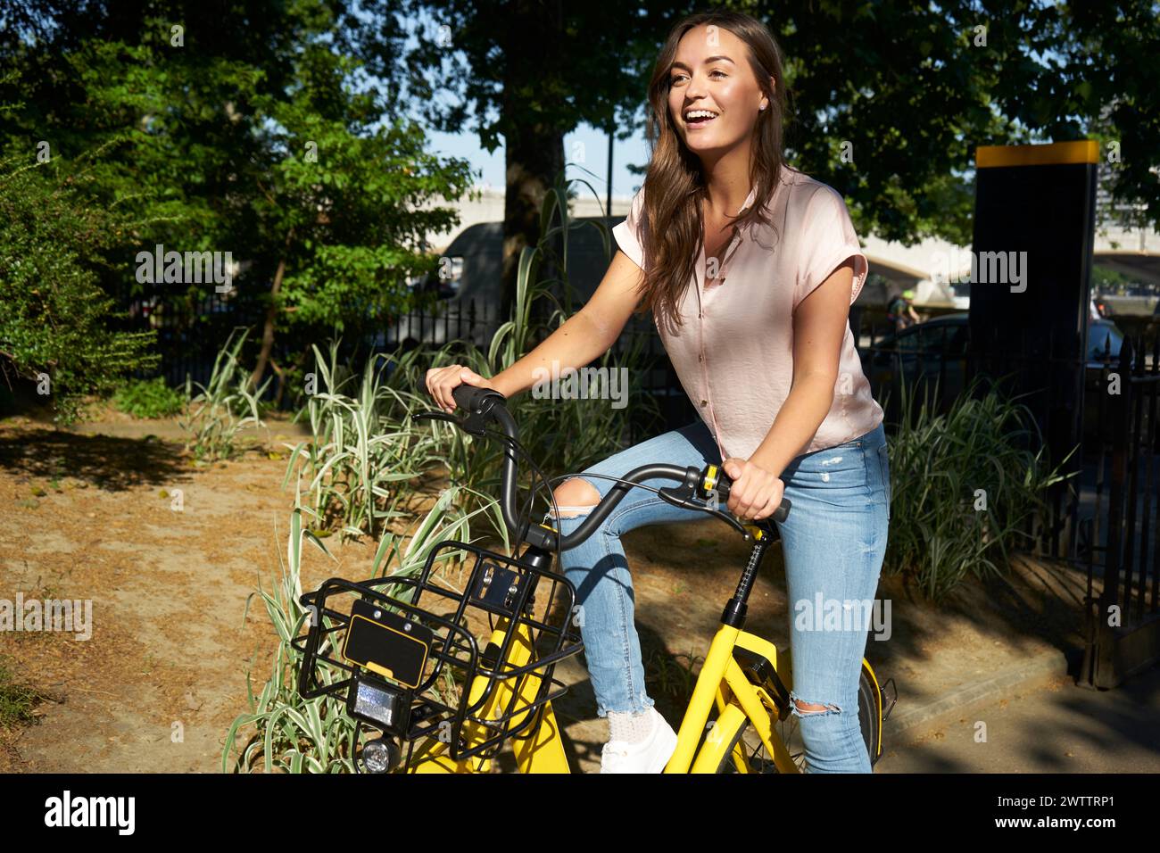 Female riding a bike hi-res stock photography and images - Alamy