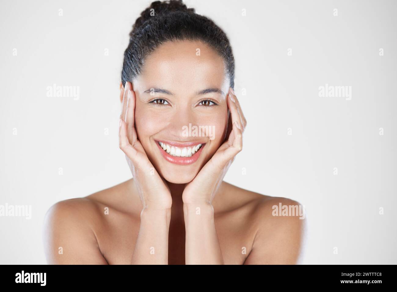 Woman smiling hands face hi-res stock photography and images - Alamy