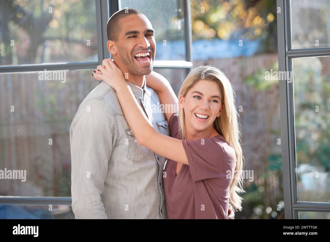 Laughing together hi-res stock photography and images - Alamy