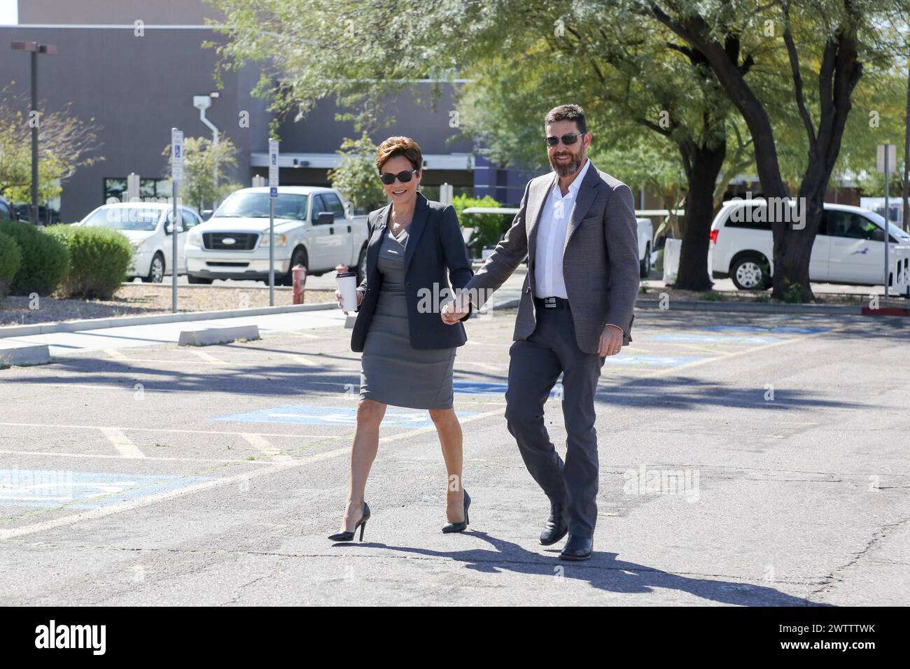 Republican Senate Candidate Kari Lake walks with her husband Jeff ...