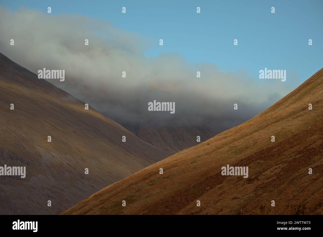 High mountains slopes shrouded in cloud. Scottish Highlands Stock Photo ...