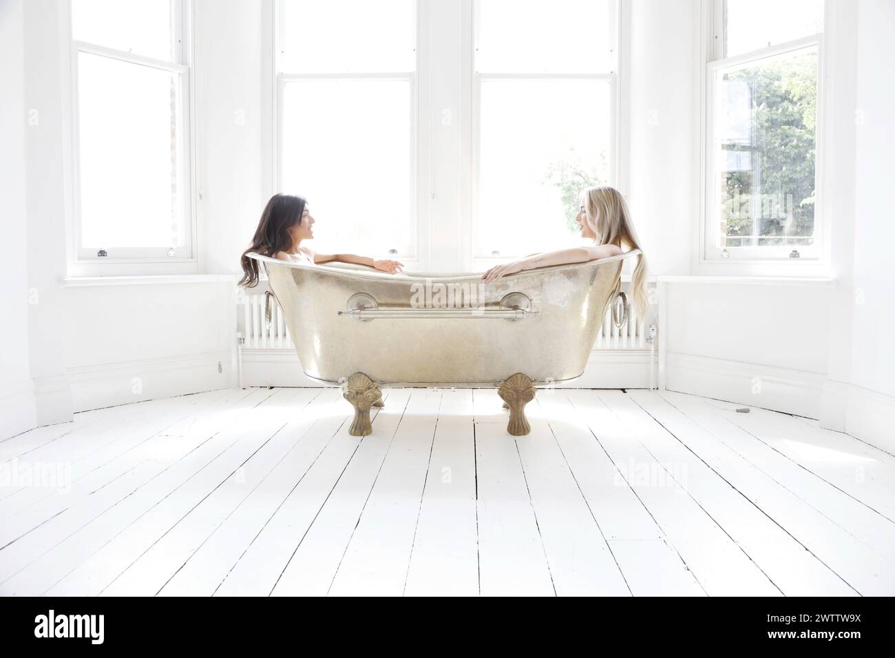 Two women in bathtub hi-res stock photography and images - Alamy