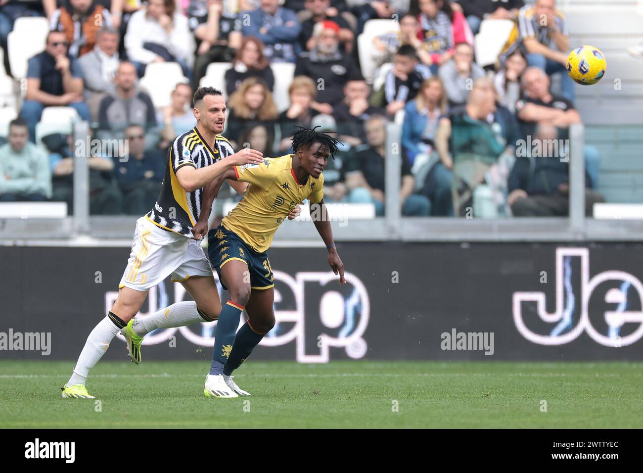 Turin, Italy. 17th Mar, 2024. Federico Gatti of Juventus tussles with David Akpan Ankeye of ...