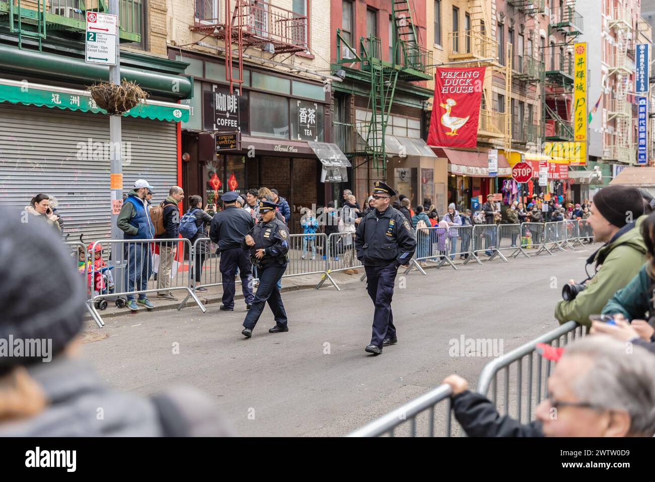 New York, Chinatown, USA - February 12, 2023: Policemen watching in Chinatown ahead of the New ...