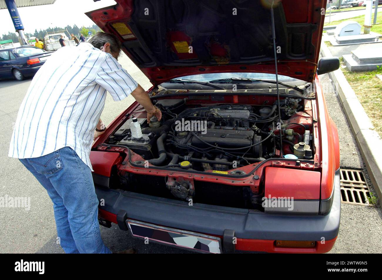 car repair after a breakdown, fixing broken parts of an automobile car ...