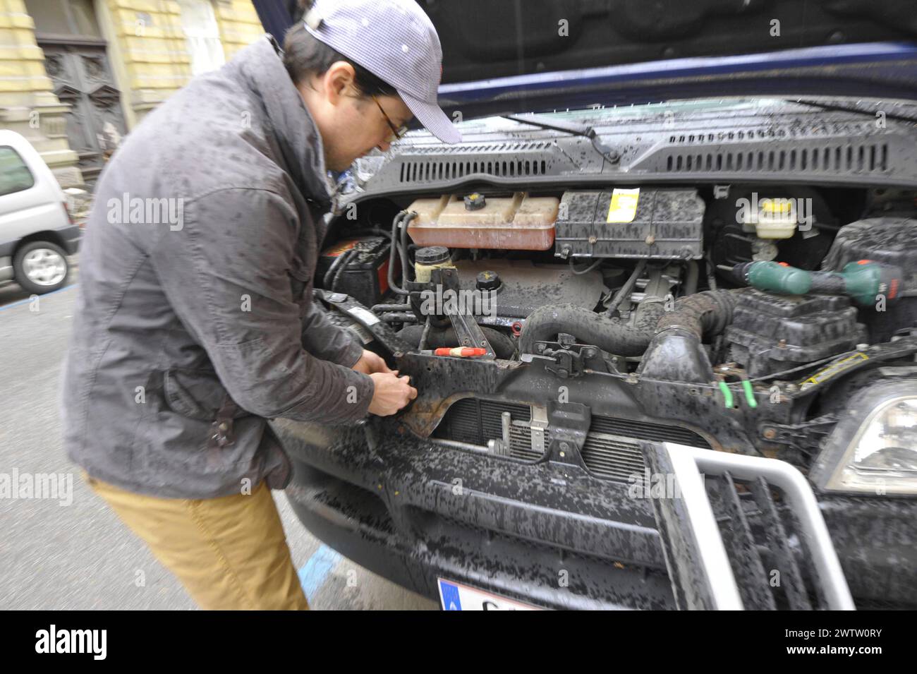 car repair after a breakdown, fixing broken parts of an automobile car ...