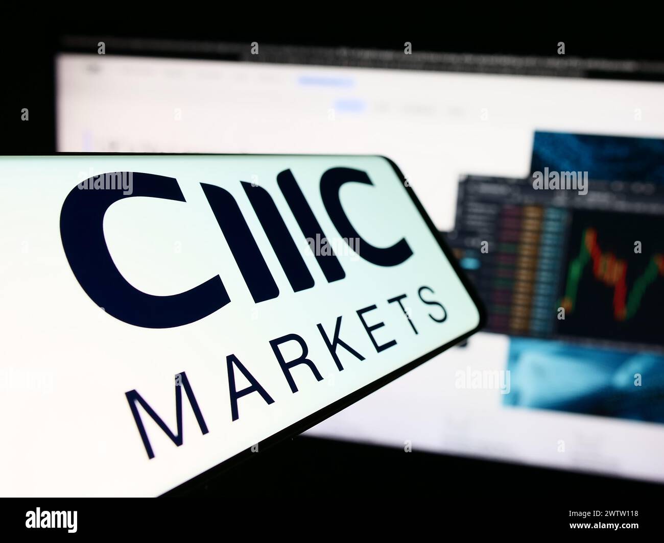 Mobile phone with logo of British financial services company CMC ...