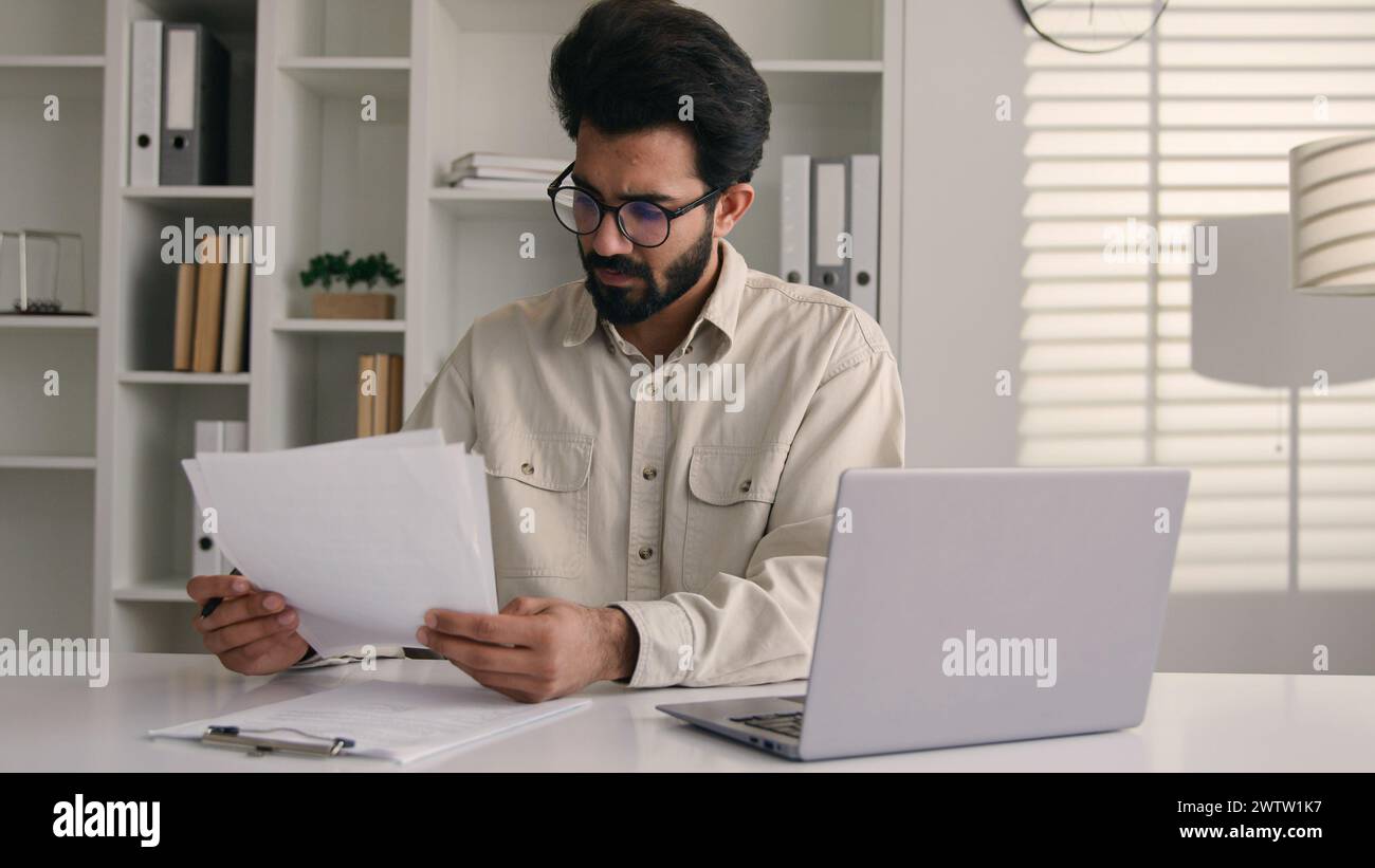 Indian businessman signing document hi-res stock photography and images ...