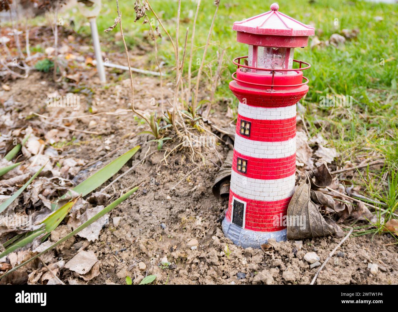 lighthouse. red and white toy lighthouse on natural background. In ...