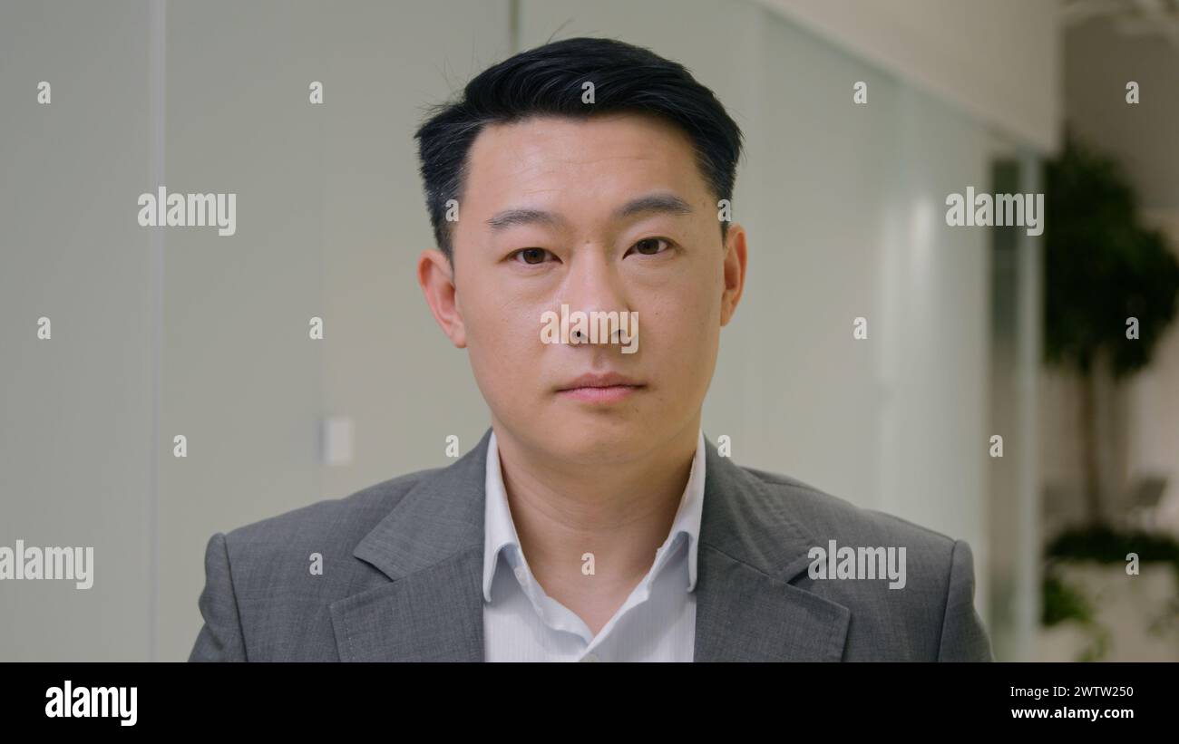 Portrait serious calm Asian ethnic man business employer peaceful ...