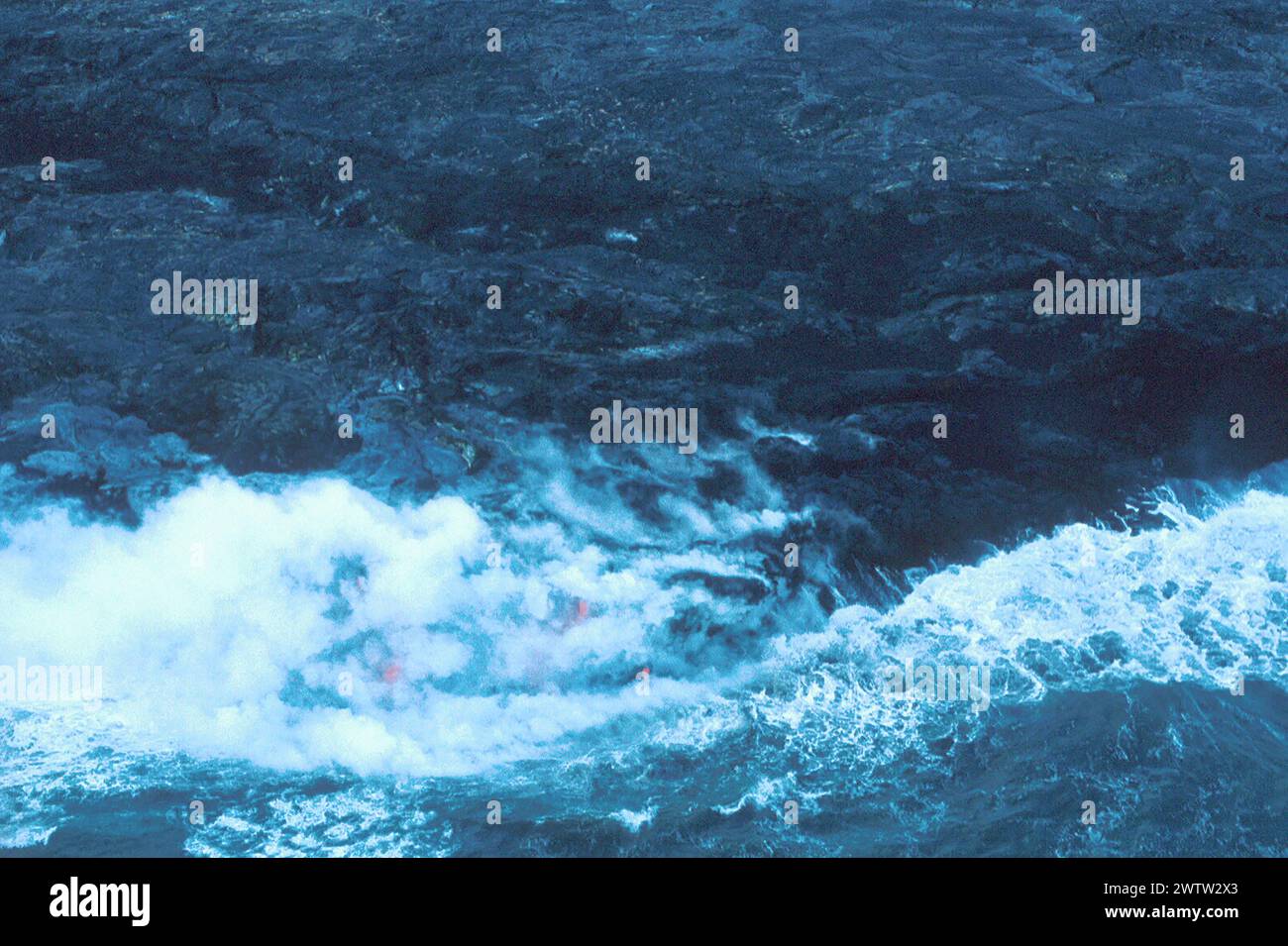 Steam from lava flowing into sea from helicopter, taken in 1992, Hawai ...