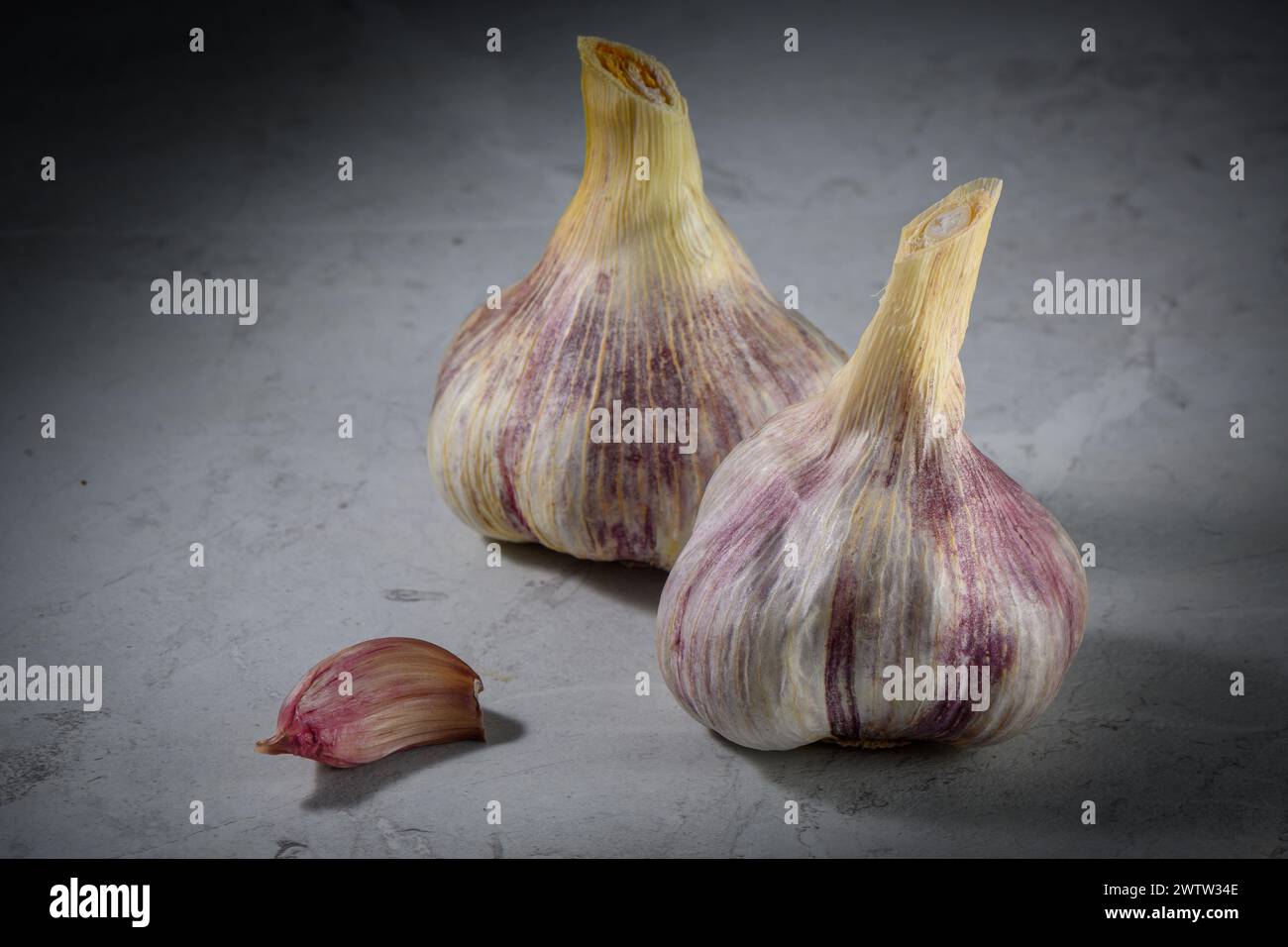 Still life photo of organic whole garlic on a light stone background 1 ...