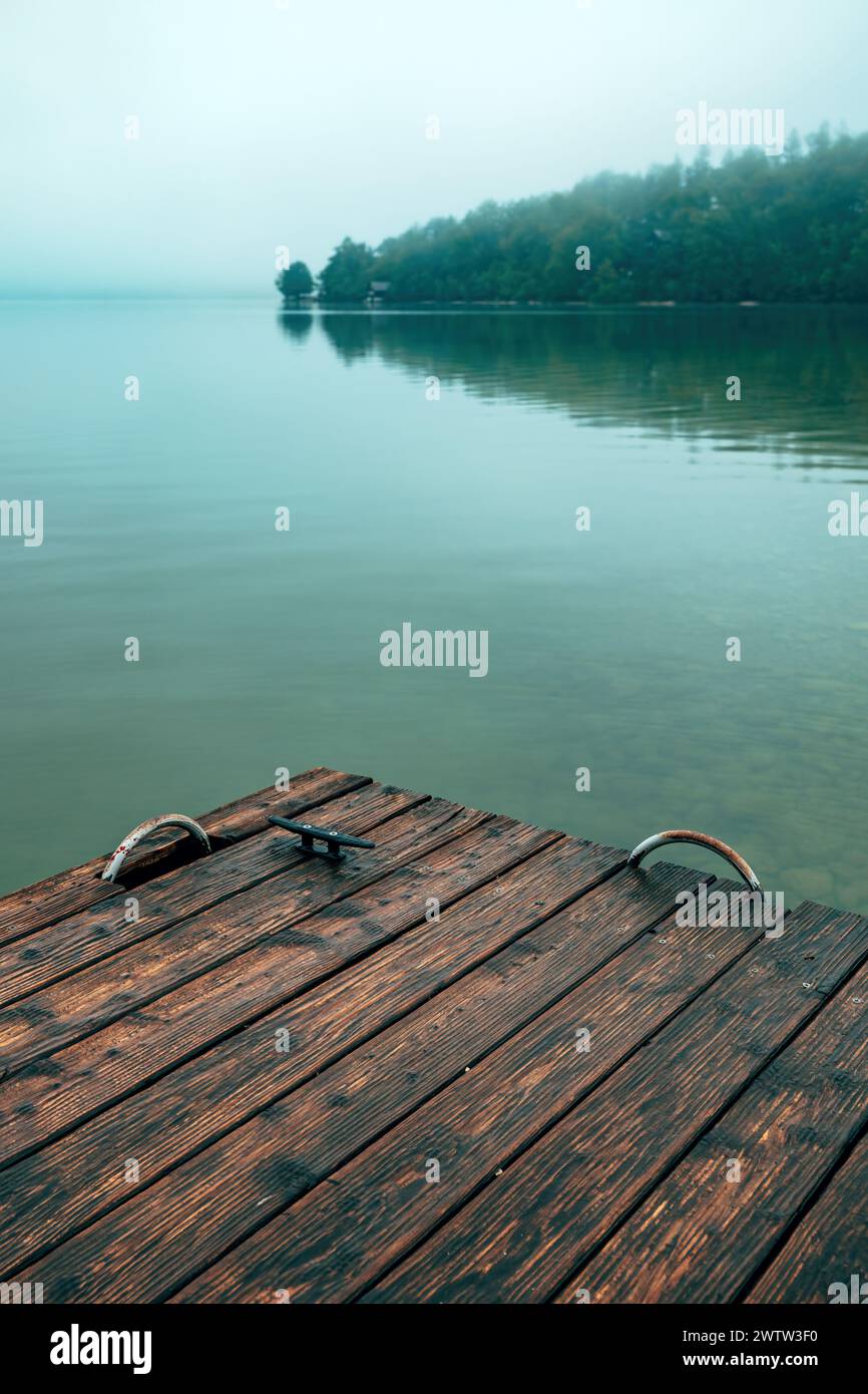 Wooden decking pier anchor at lake Bohinj in Slovenia, selective focus ...