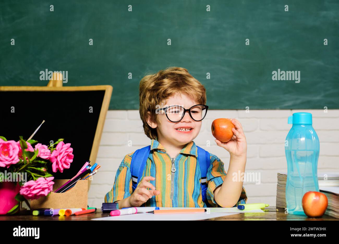 Healthy dinner or breakfast in school. Little child boy from elementary ...
