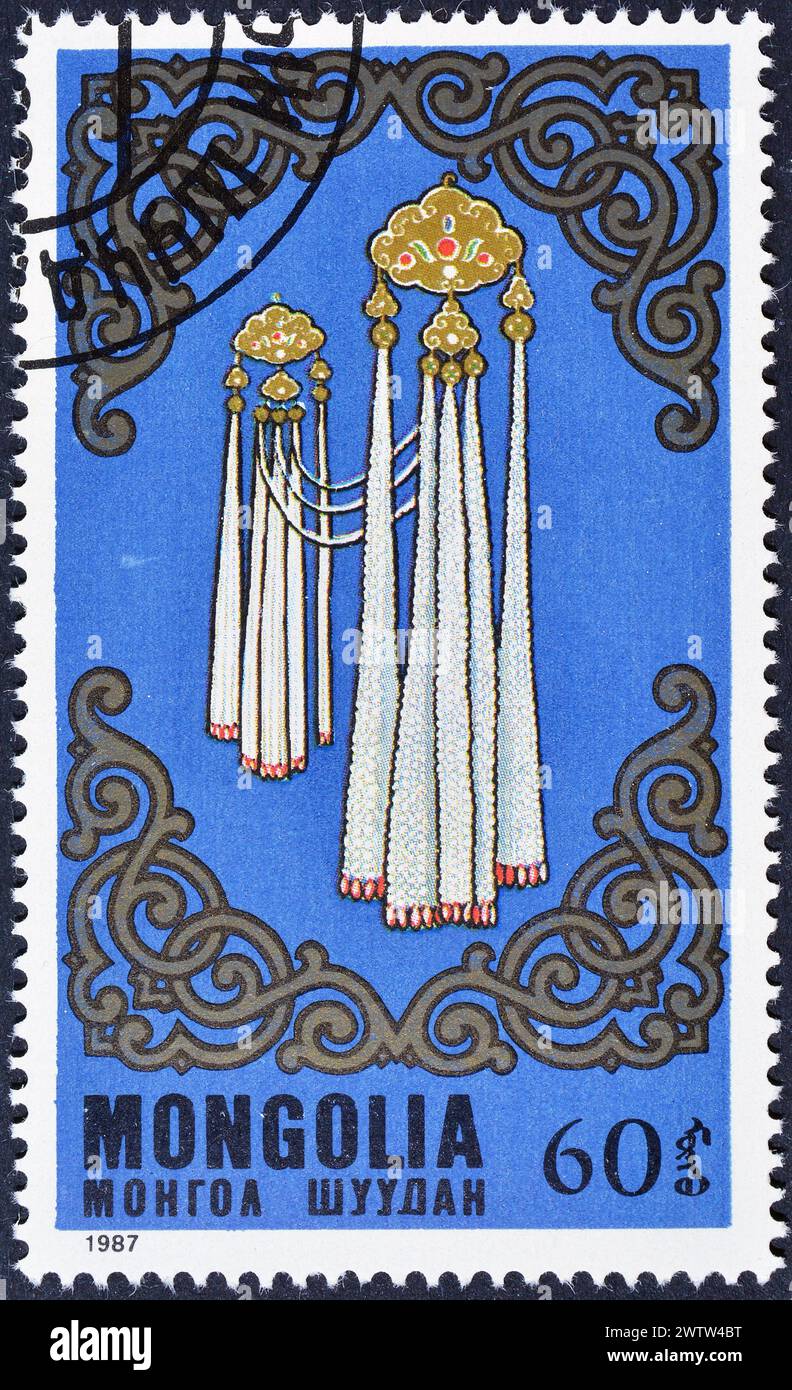 Cancelled postage stamp printed by Mongolia, that shows Costumes and ...